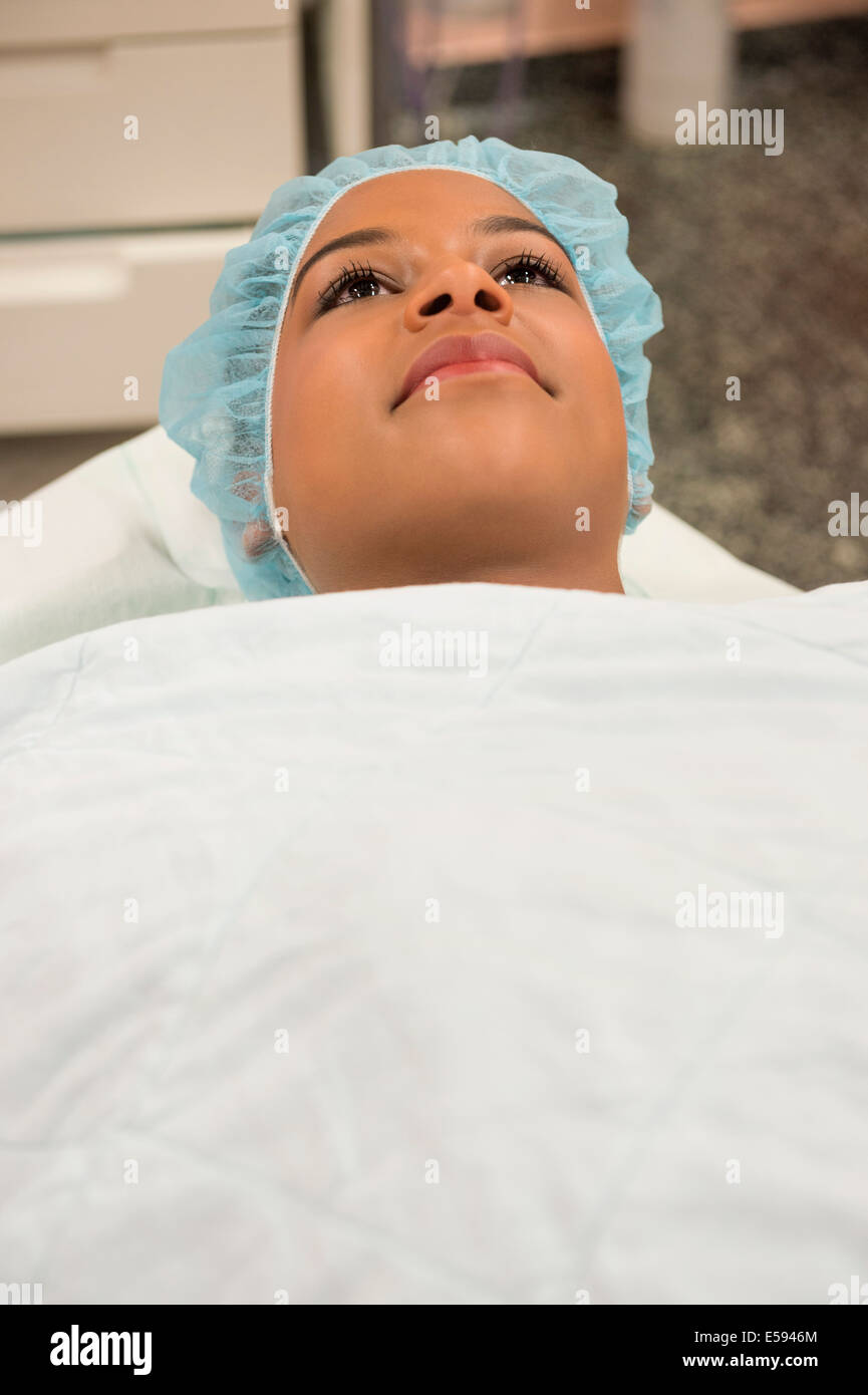 Female patient lying on a stretcher in an operating room Stock Photo ...