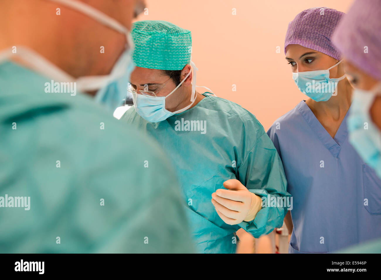 Medical team performing an operation in an operating room Stock Photo ...