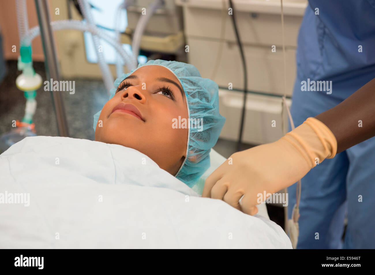 Female patient lying on a stretcher in an operating room Stock Photo ...