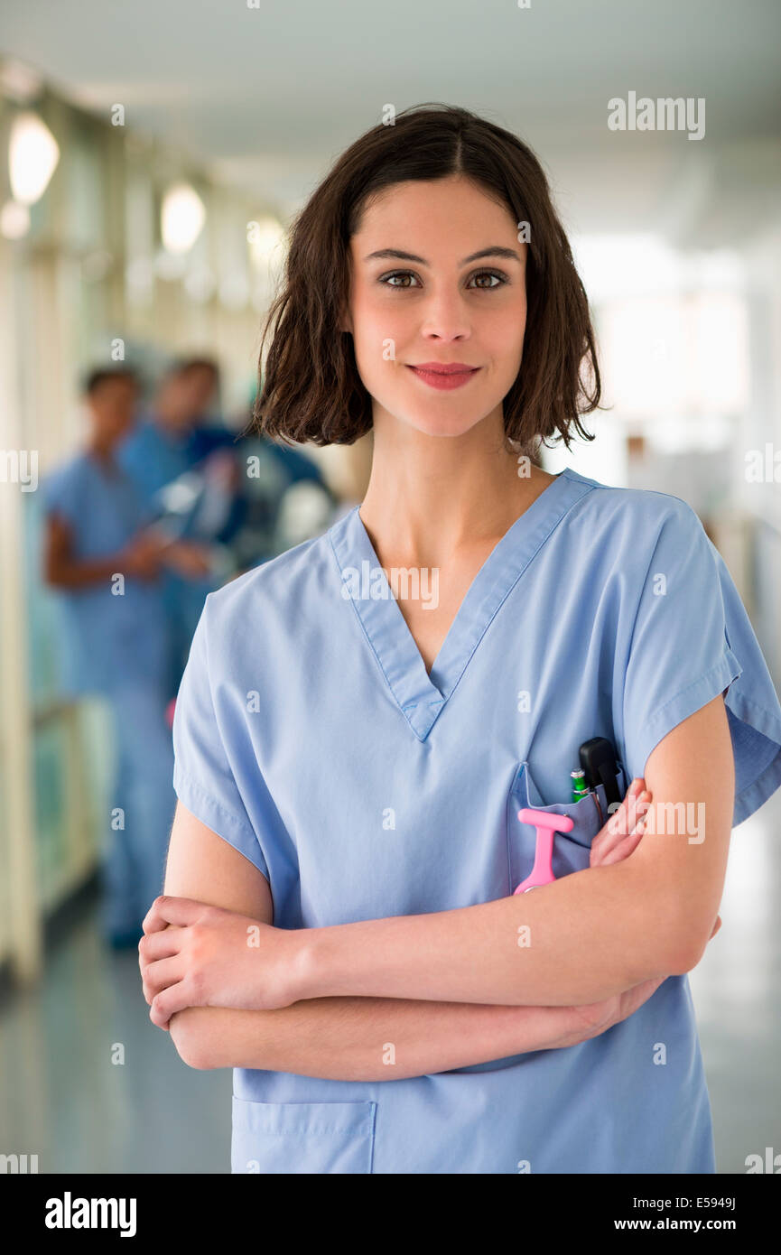 Portrait of a female nurse standing with her arms crossed Stock Photo ...
