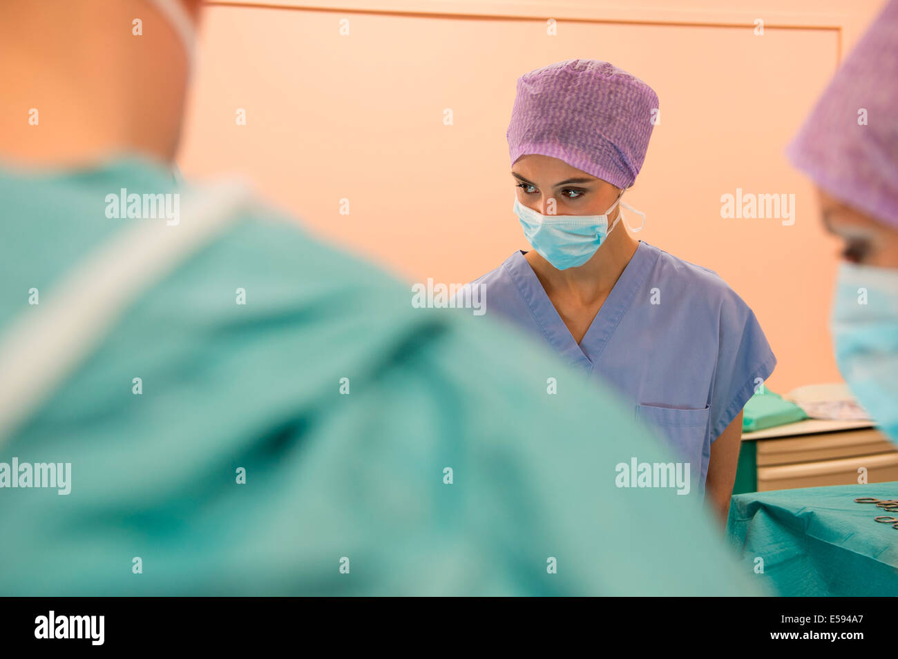 Medical team performing an operation in an operating room Stock Photo ...