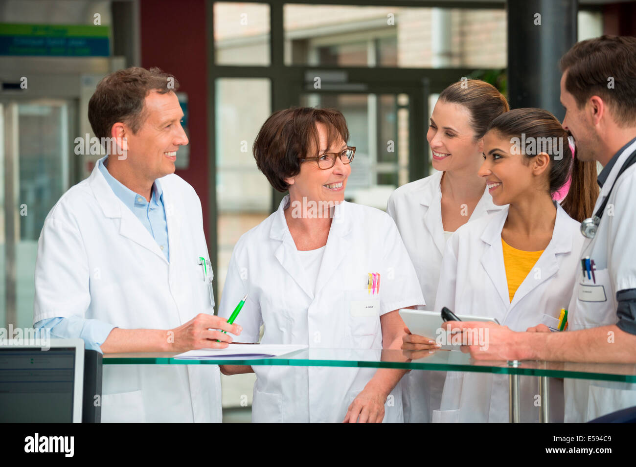 Medical-team talking and smiling Stock Photo - Alamy