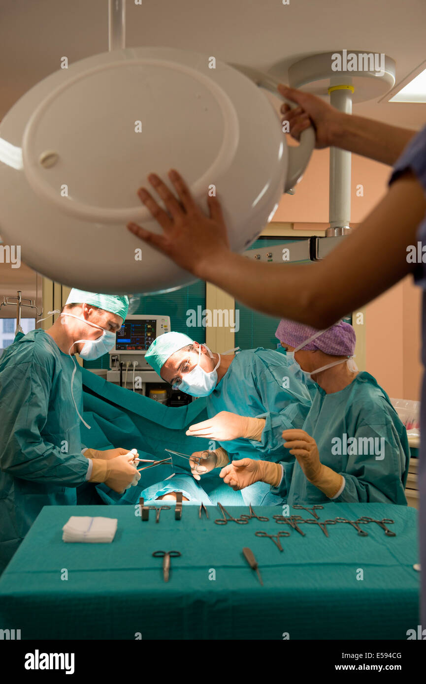 Medical team operating a patient in an operating room Stock Photo - Alamy