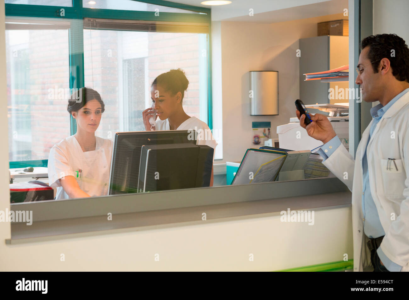 Busy hospital nurse hi-res stock photography and images - Alamy
