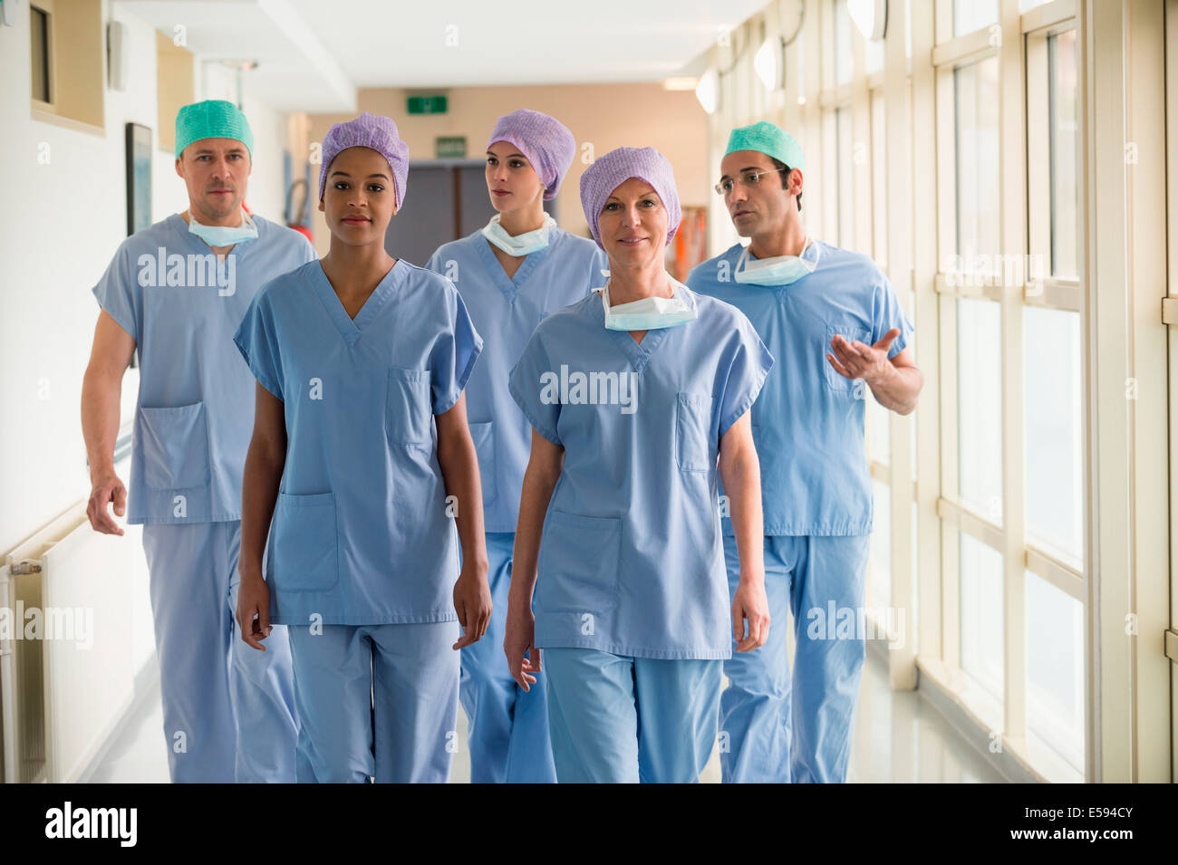 Medical team walking in the corridor of a hospital Stock Photo - Alamy