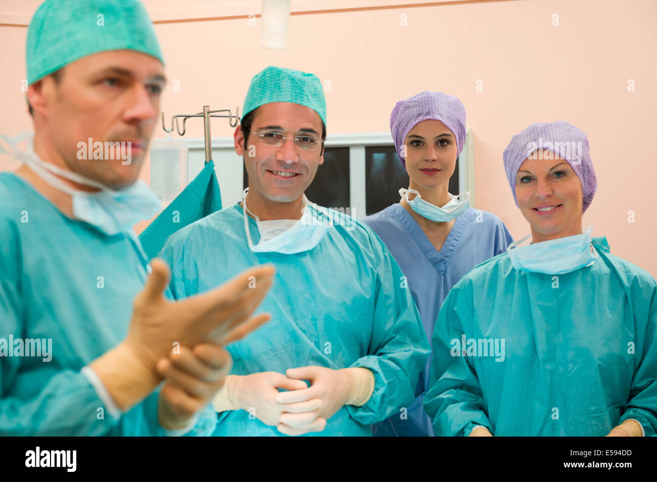 Medical team smiling in an operating room Stock Photo - Alamy