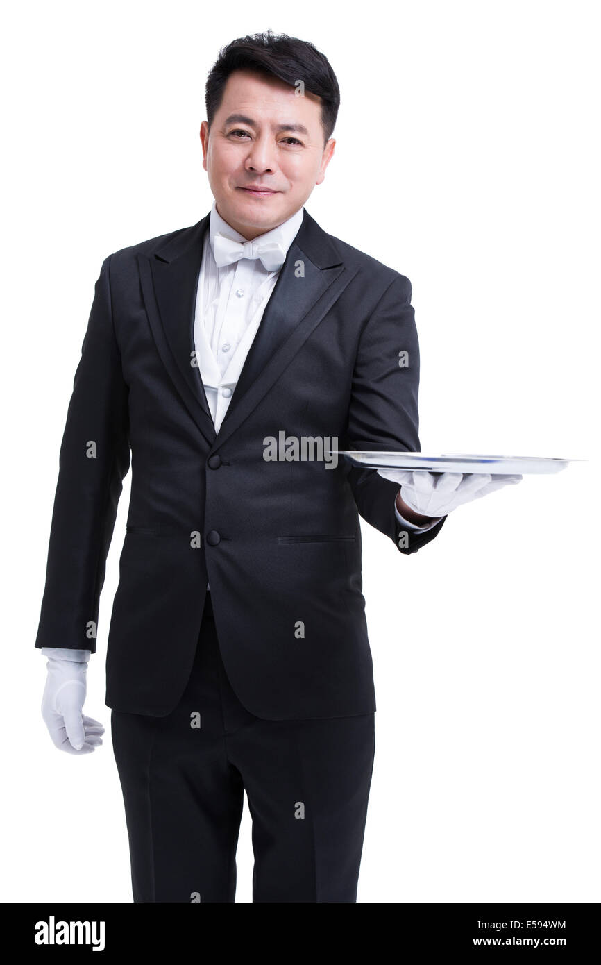 Happy waiter with serving tray Stock Photo - Alamy