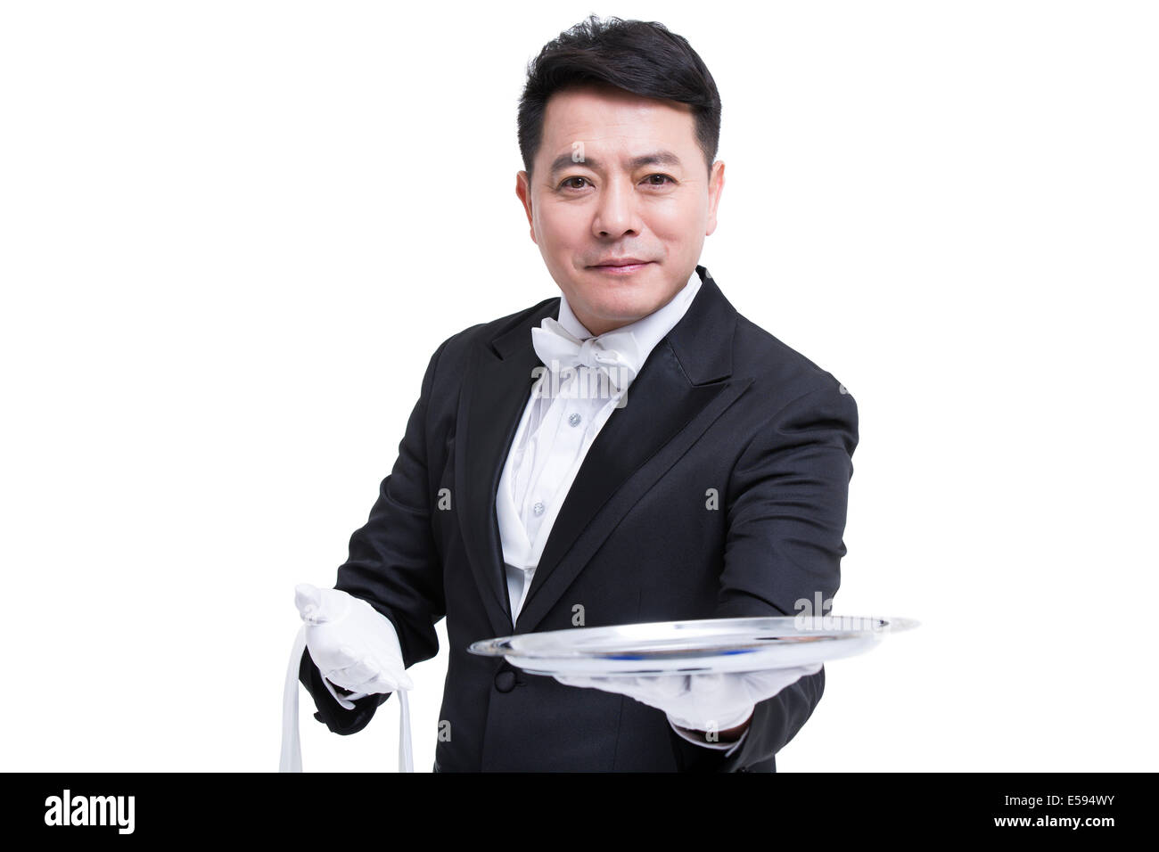 Happy waiter with serving tray Stock Photo - Alamy