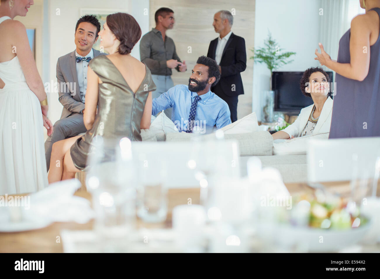 Friends talking at party Stock Photo - Alamy