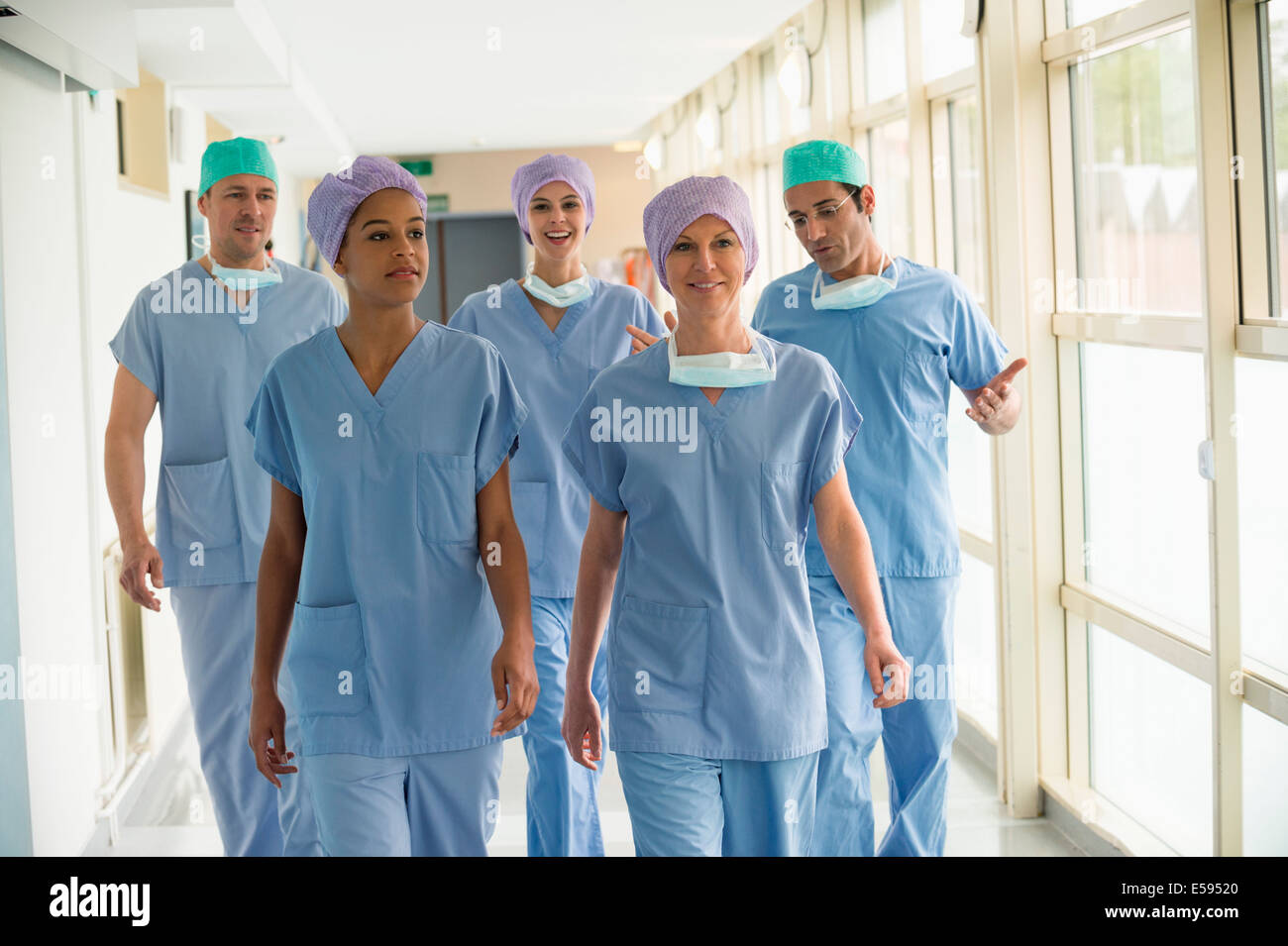 Medical team walking in the corridor of a hospital Stock Photo - Alamy