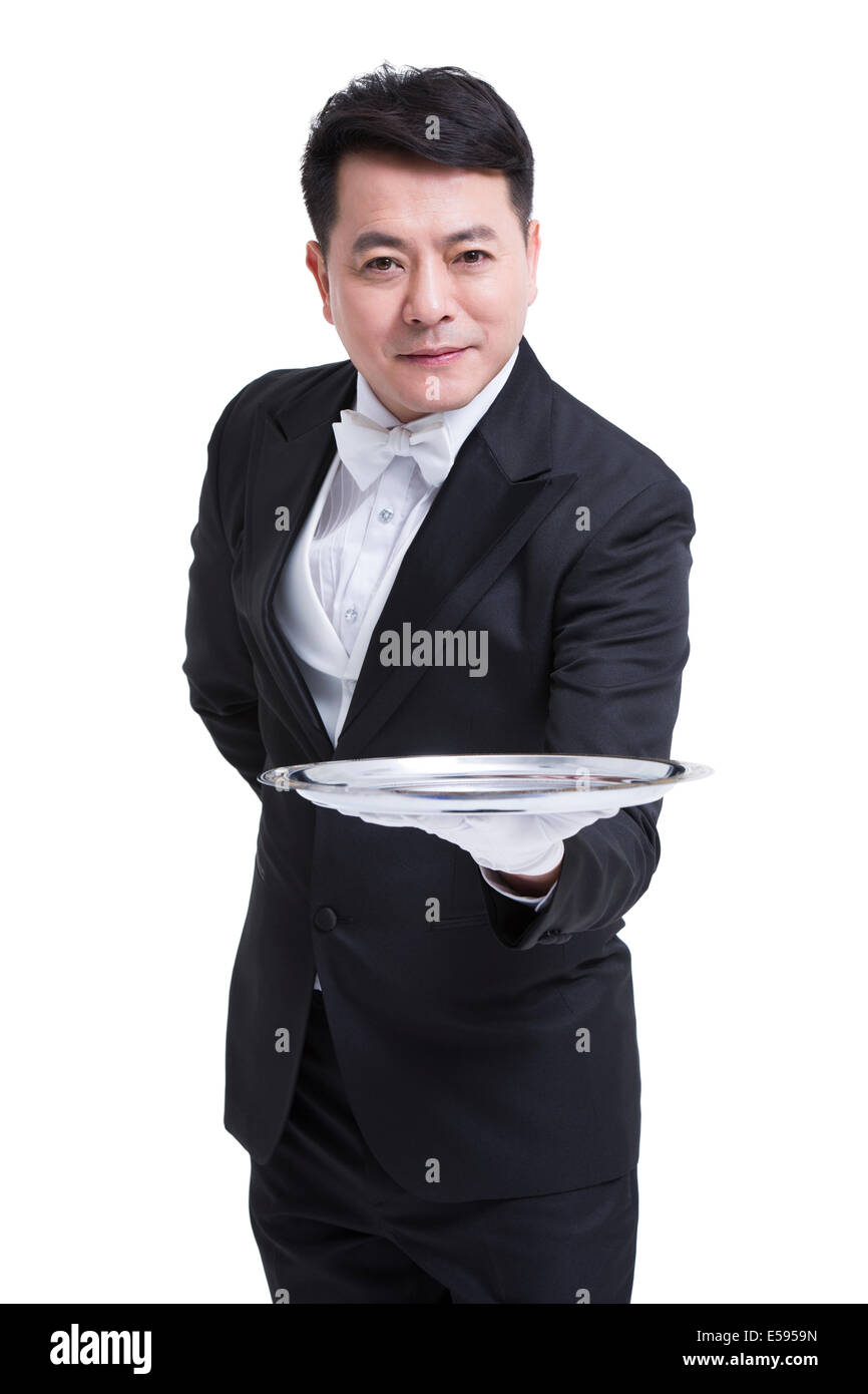 Happy waiter with serving tray Stock Photo - Alamy