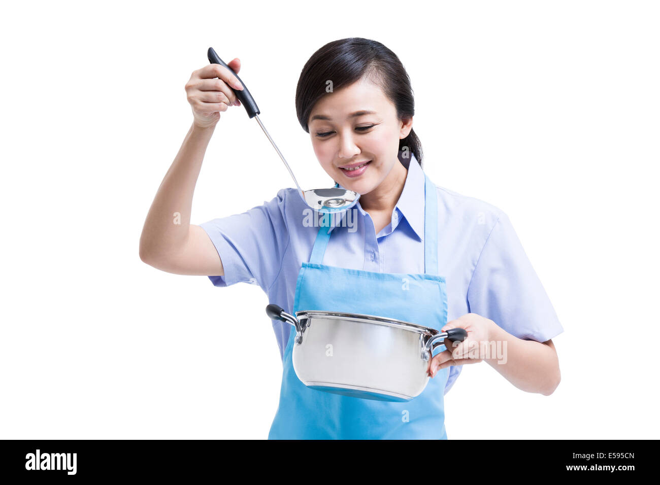 Domestic servant cooking Stock Photo - Alamy