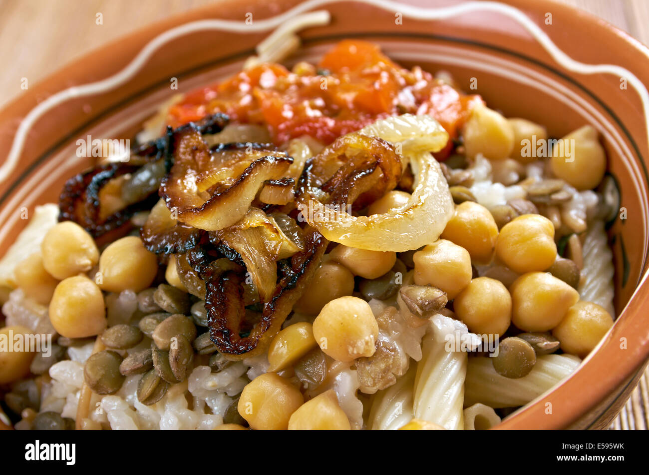 Kushari - is an Egyptian dish of rice, macaroni and lentils mixed ...