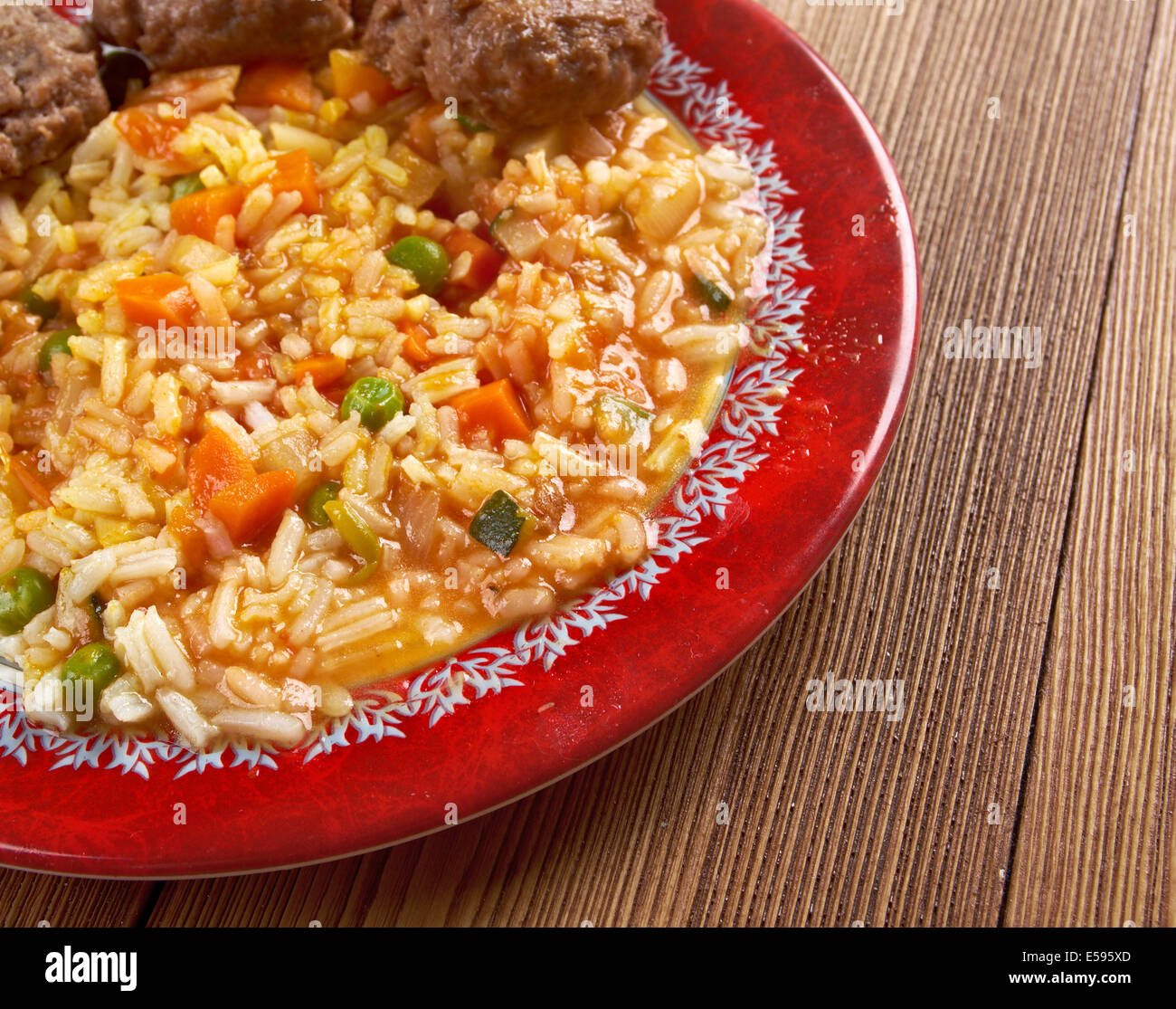 Jollof rice also called 'Benachin' is a popular dish in many parts of ...