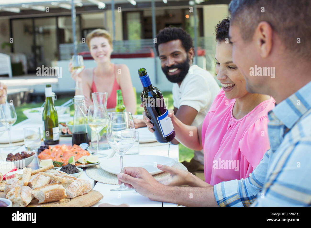 Friends eating together outdoors Stock Photo - Alamy