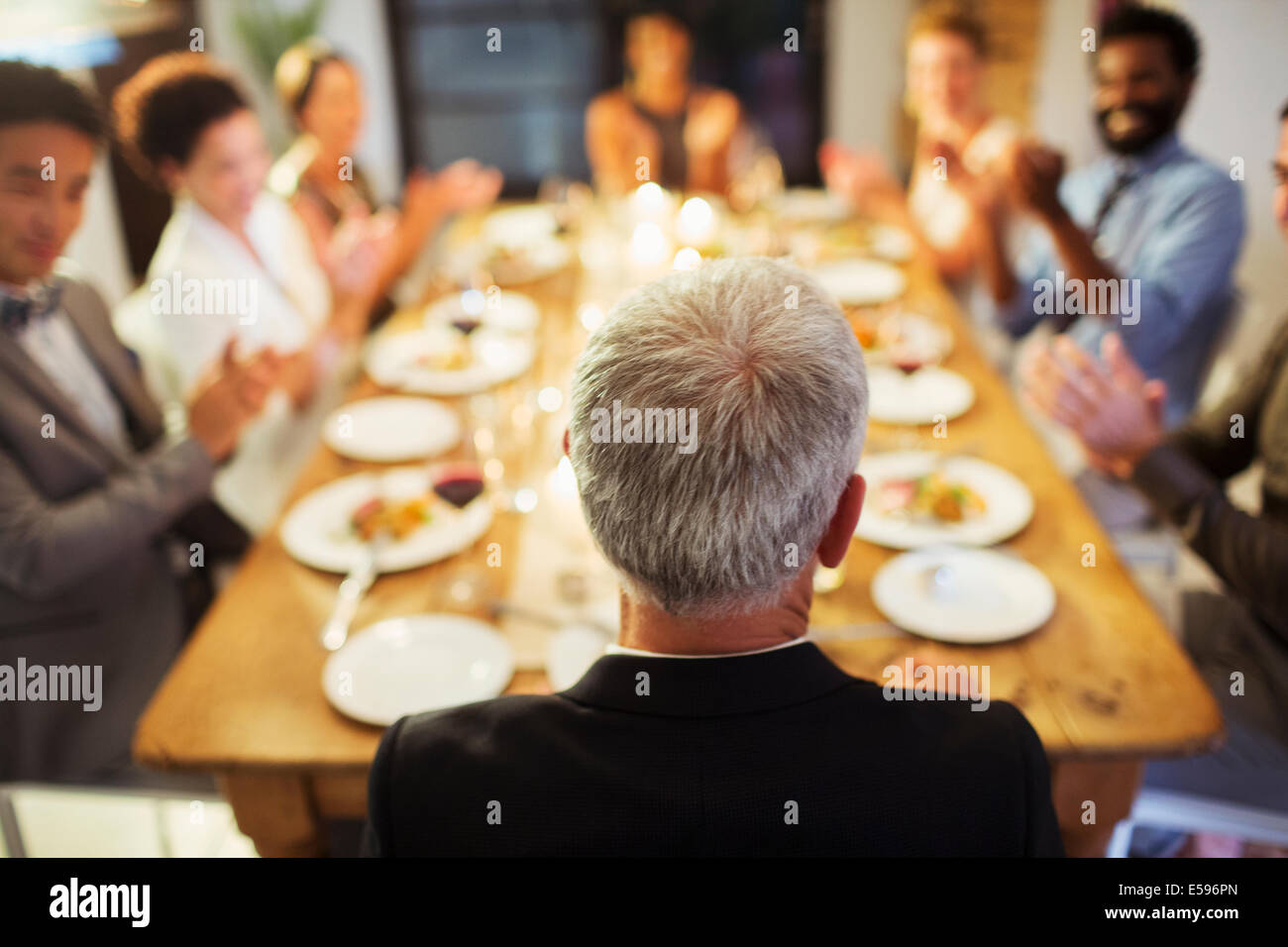 Friends applauding at dinner party Stock Photo - Alamy