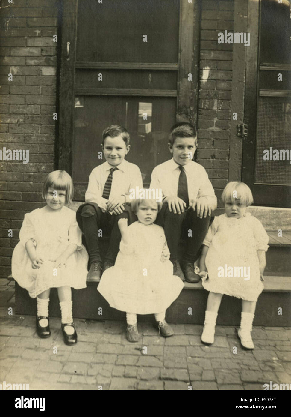 A photographic postcard by John Frank Keith, featuring a group portrait ...