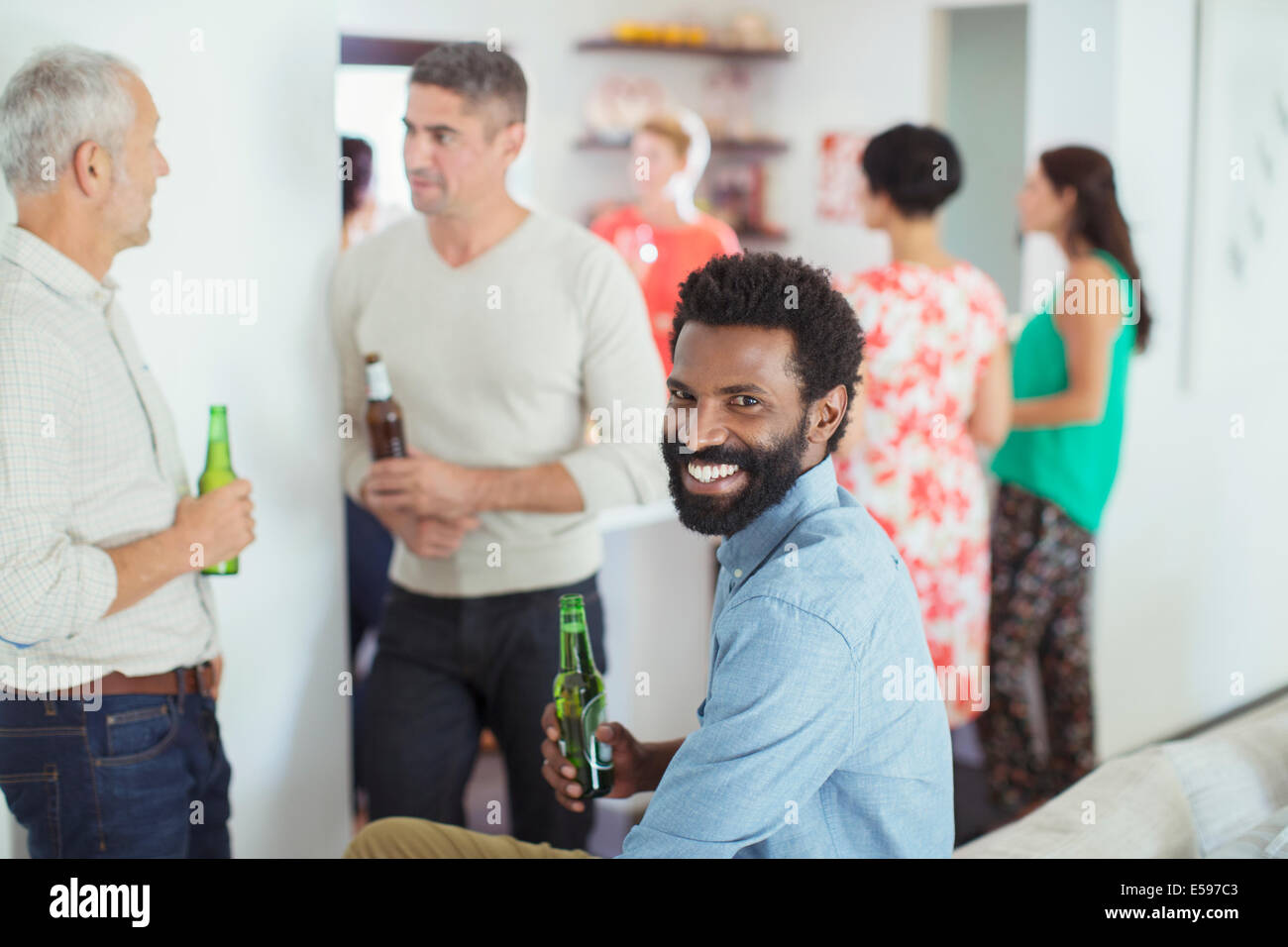 Man smiling at party Stock Photo - Alamy