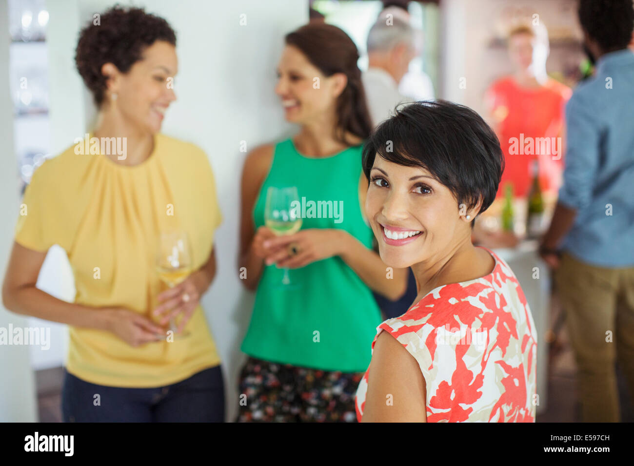 Woman smiling at party Stock Photo - Alamy