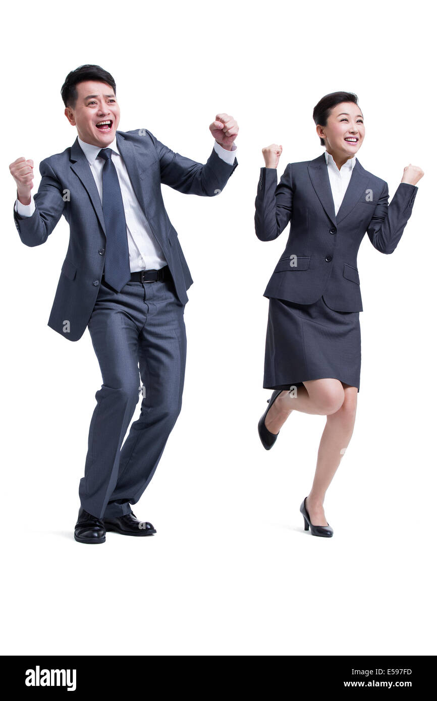 Excited business people celebrating Stock Photo - Alamy