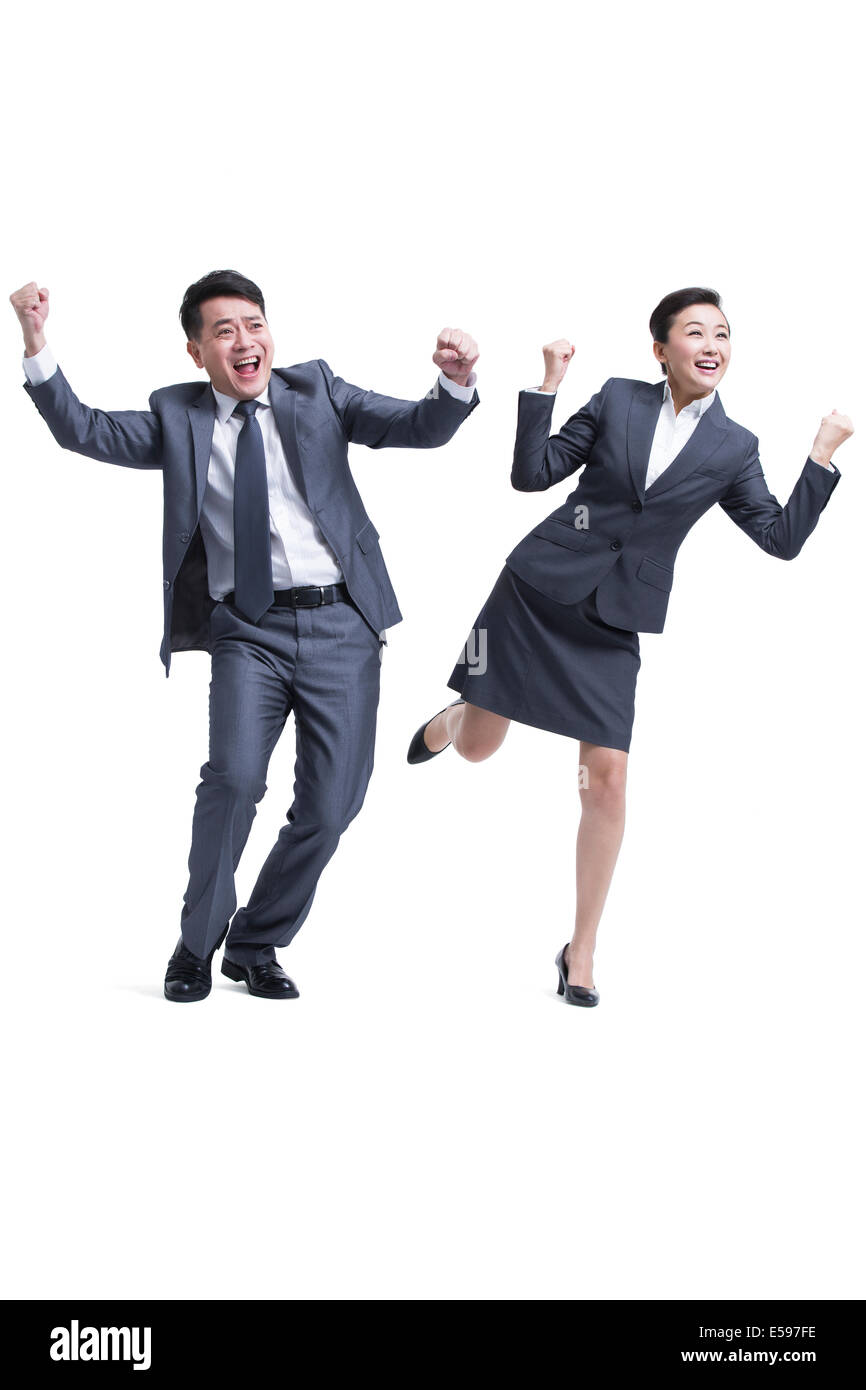 Excited business people celebrating Stock Photo - Alamy