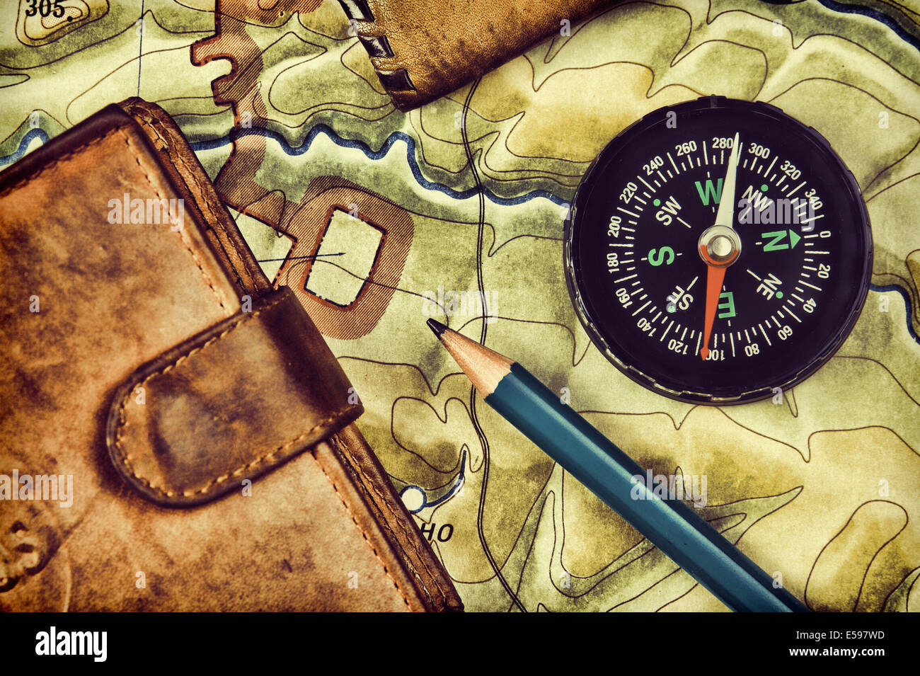 compass wallet and passport on the old map Stock Photo - Alamy