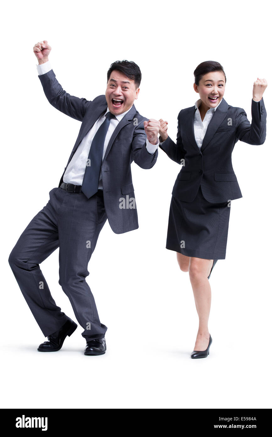 Excited business people celebrating Stock Photo - Alamy