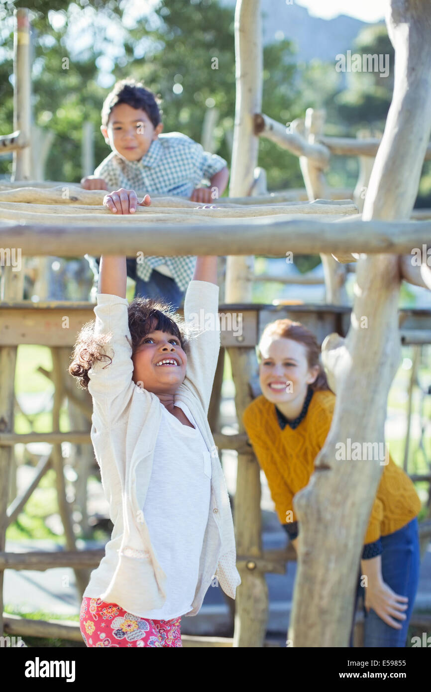 Teachers and students playing on play structure Stock Photo - Alamy