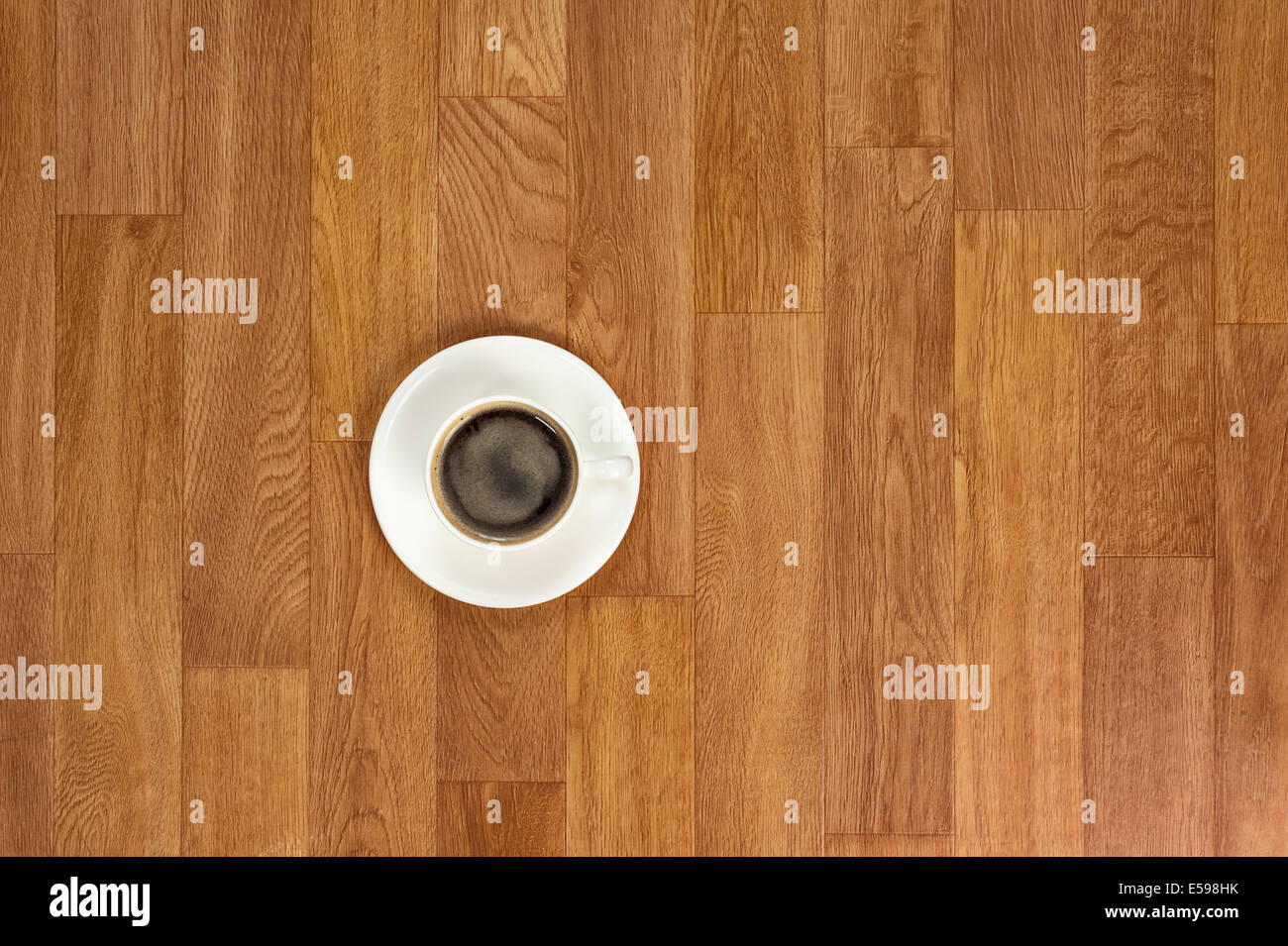 White cup of coffee on wooden table. Above view Stock Photo - Alamy