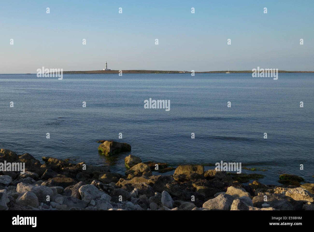 Early morning seascape view of lighthouse on Isla Del Aire from nearby ...