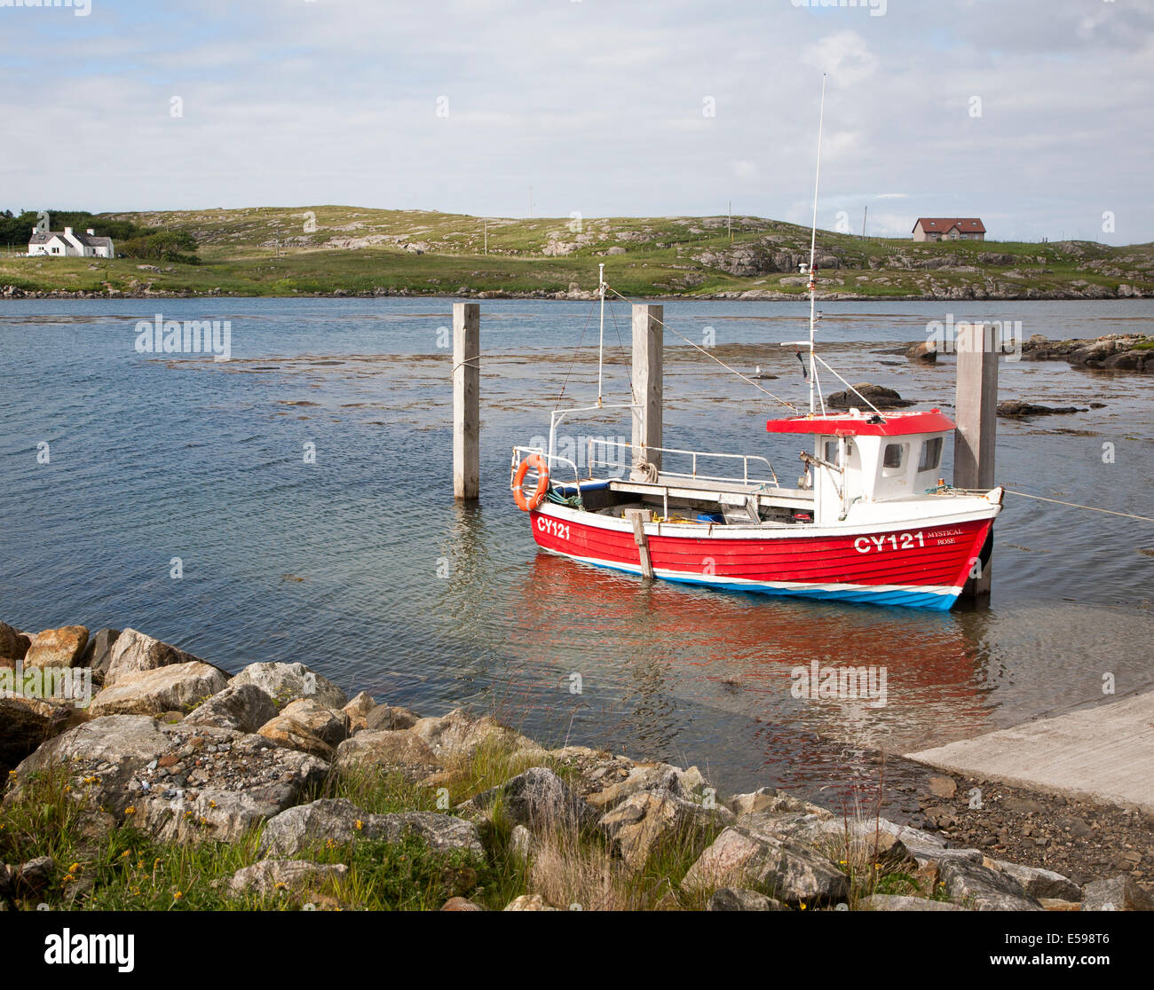 Small fishing boat on the east coast of Barra, Outer Hebrides, Scotland ...