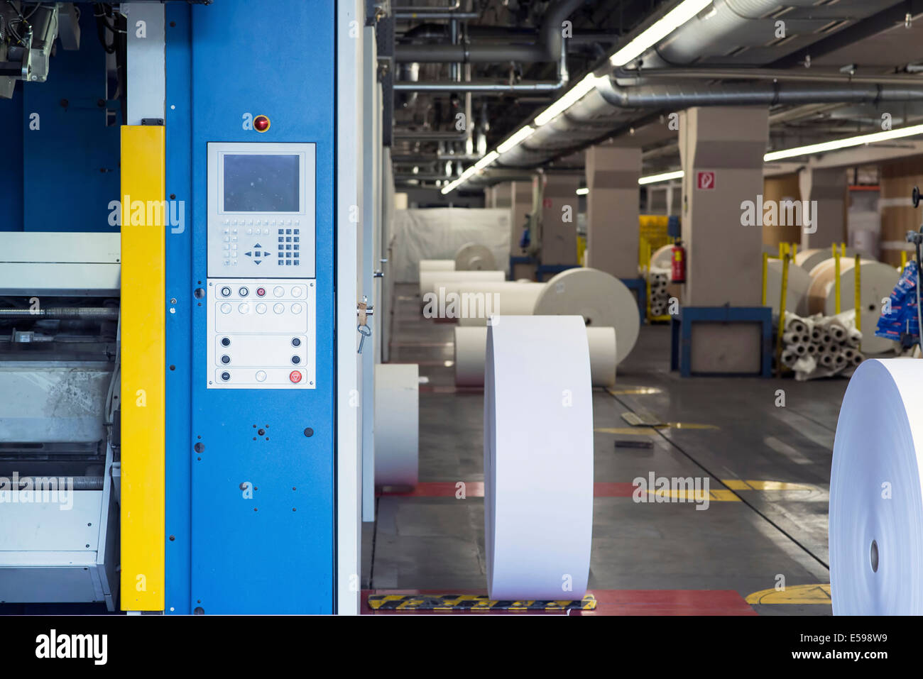 Presses with rolls of paper in a printing shop Stock Photo - Alamy