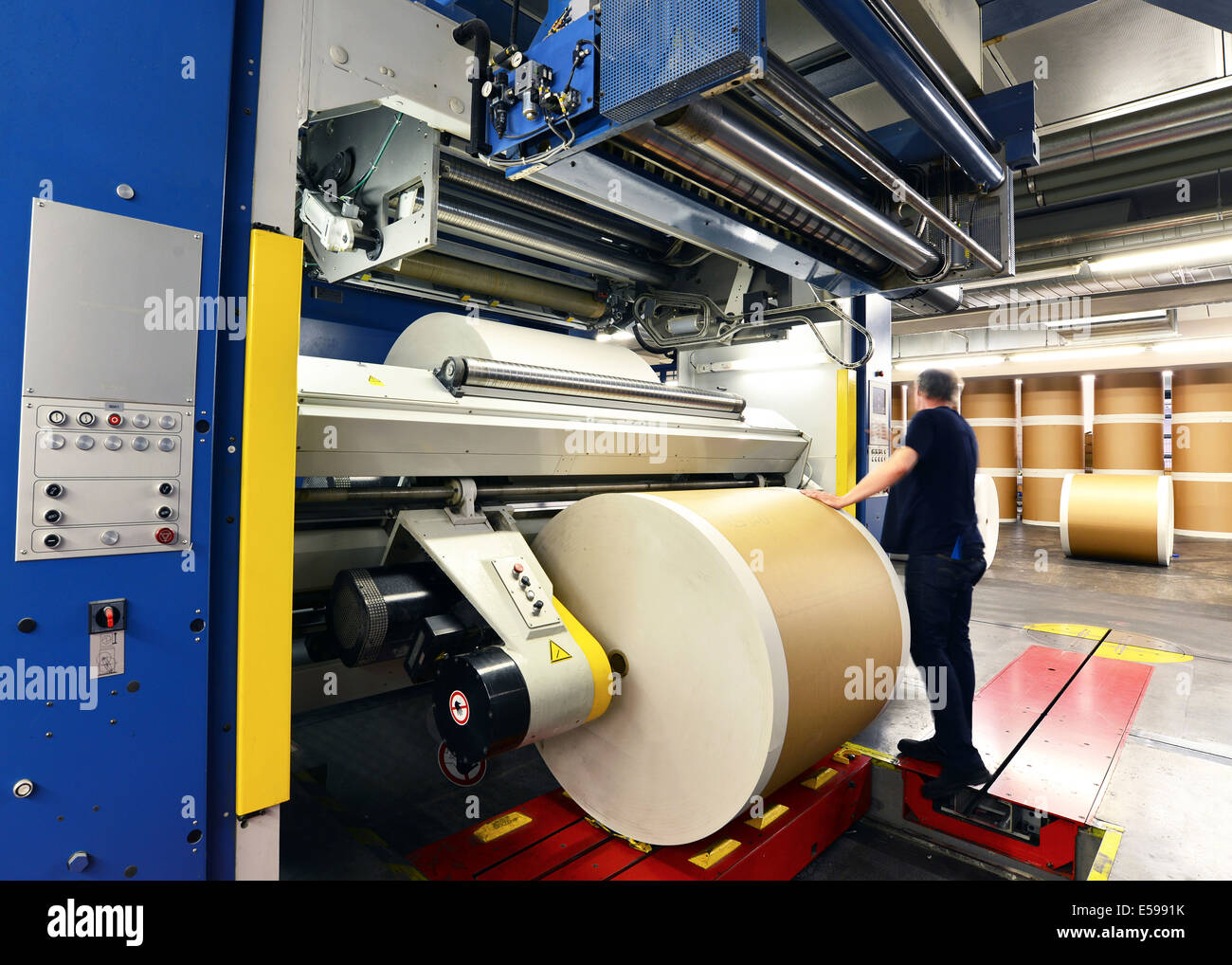 Presses with rolls of paper in a printing shop Stock Photo - Alamy