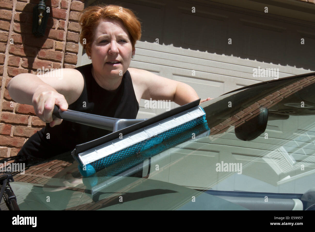 Cleaning windshield hi-res stock photography and images - Alamy