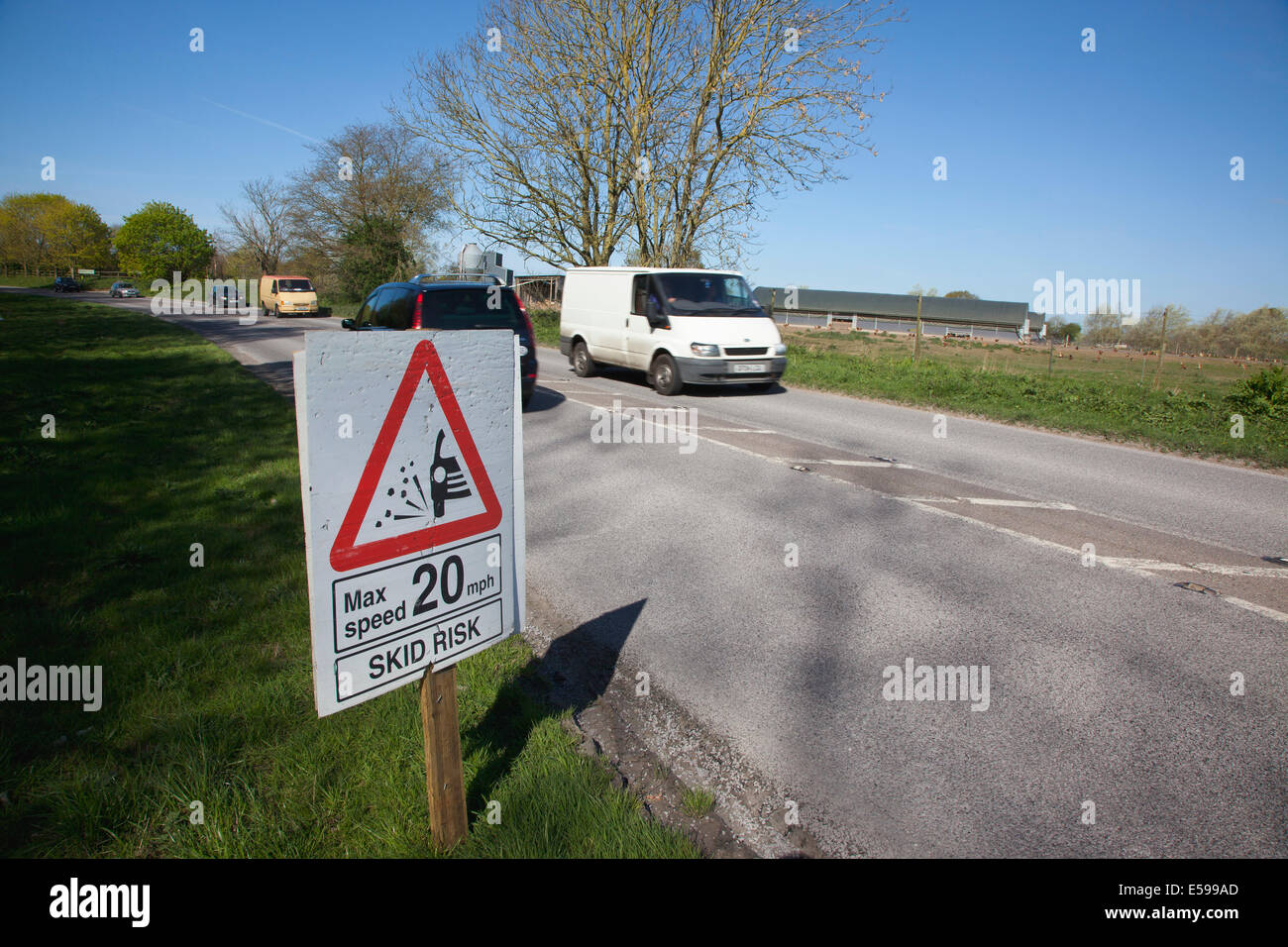 Transport, Road, Cars, resurfaced road with sign warning of reduced ...