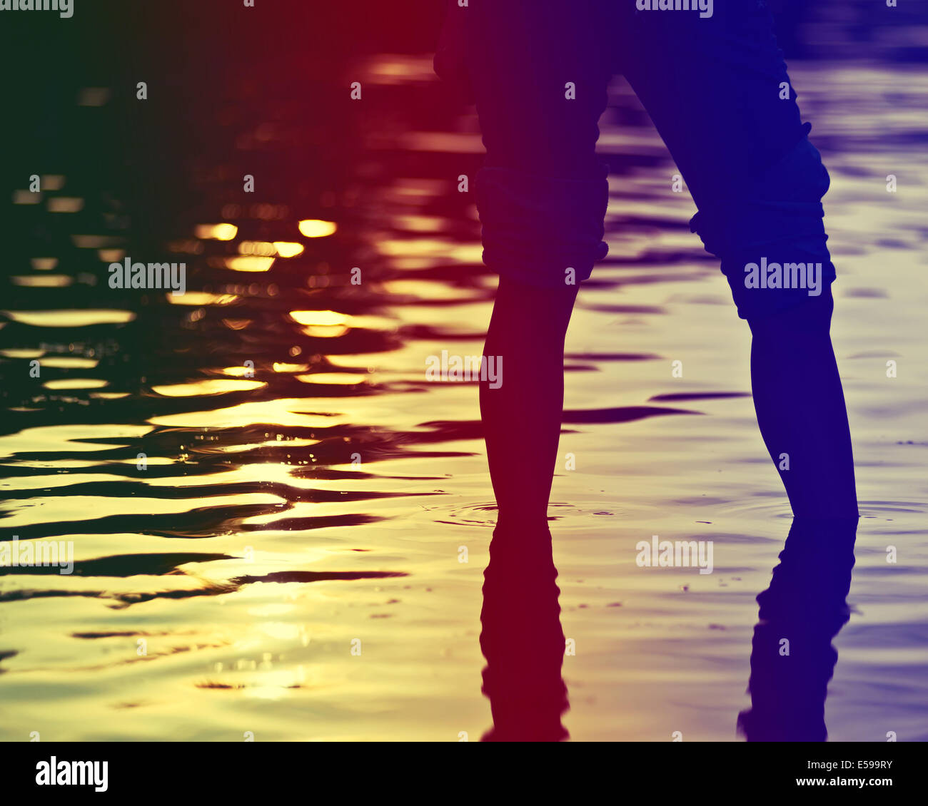 Tanned legs on the beach hi-res stock photography and images - Alamy