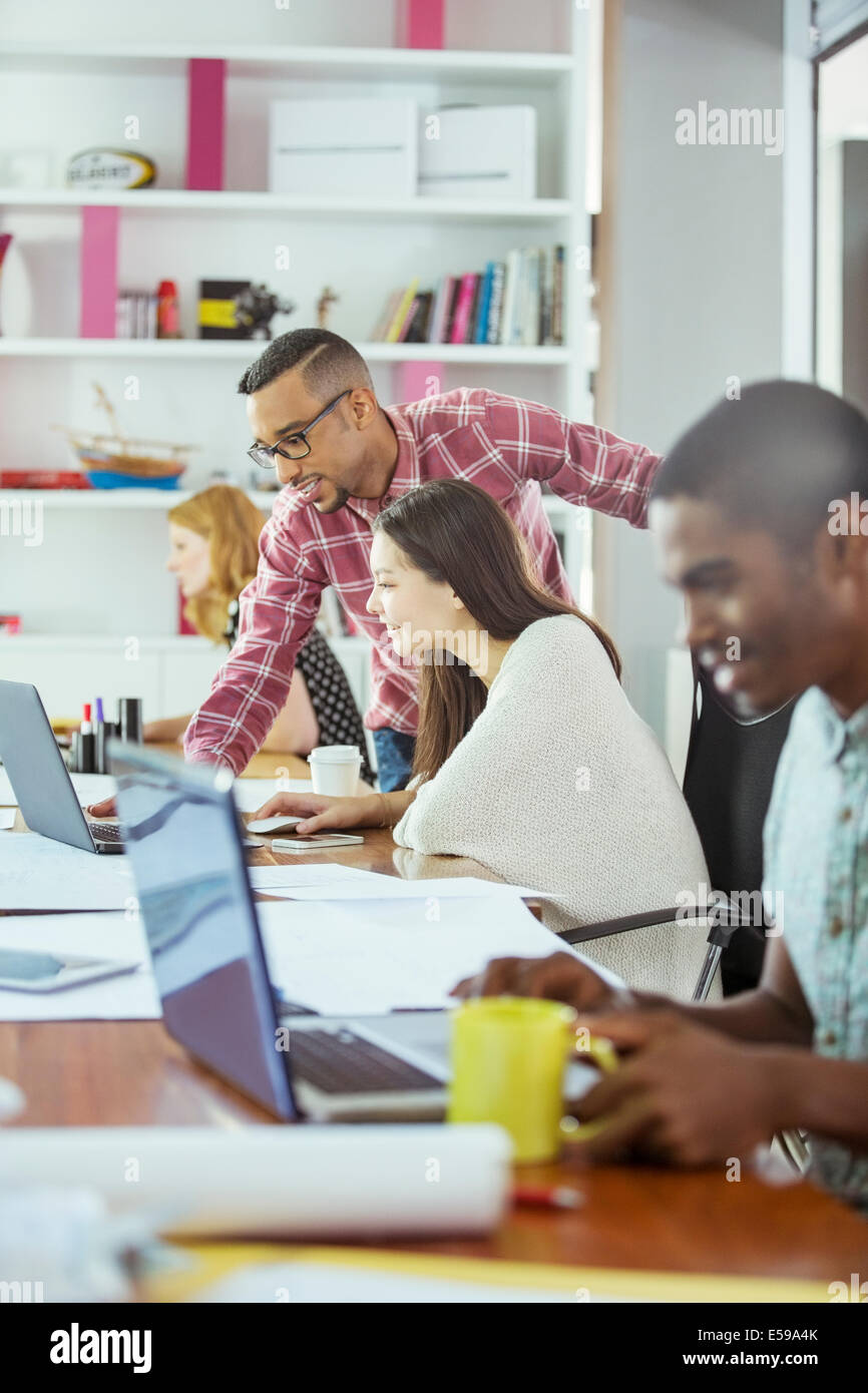 People working at conference table in office Stock Photo - Alamy