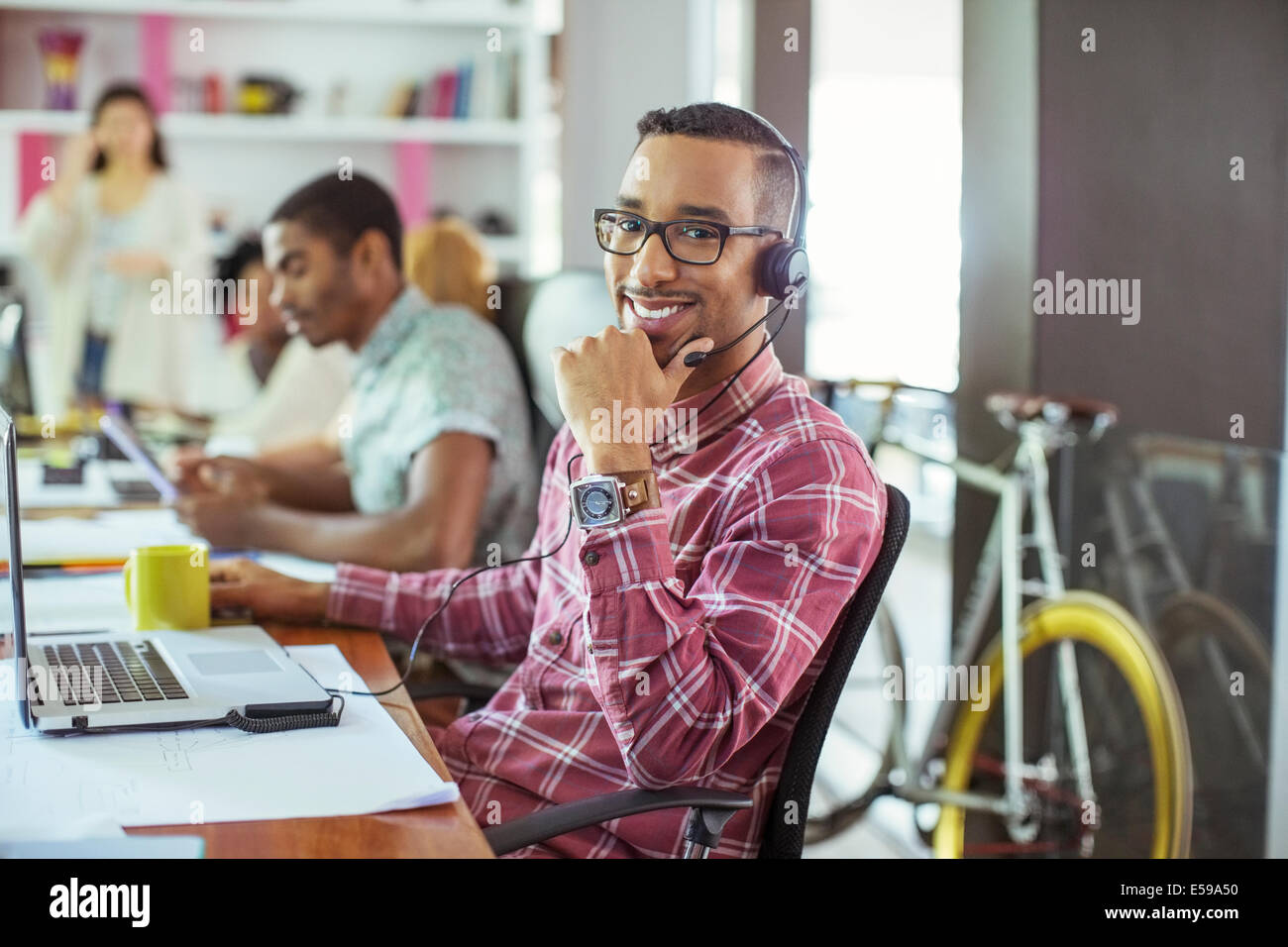 Happy Office Worker At Desk