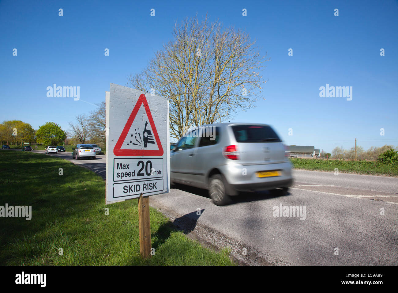 Transport, Road, Cars, resurfaced road with sign warning of reduced ...