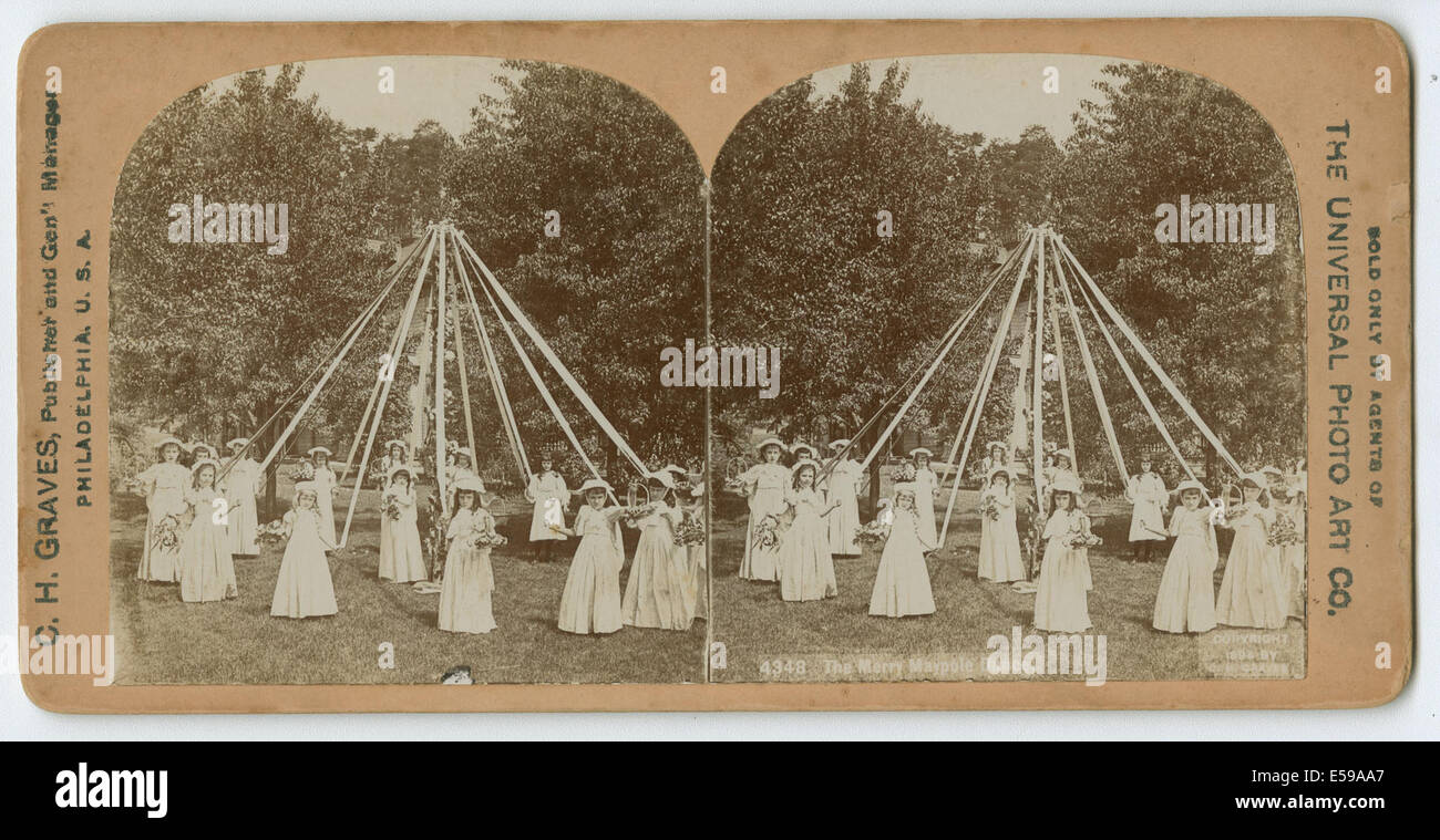 A stereograph showing girls participating in a Maypole dance in ...