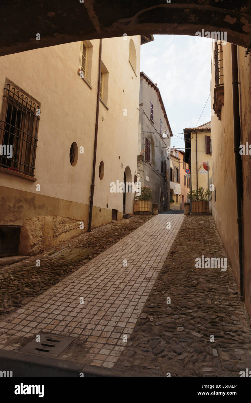 Narrow street in the old town in Italy Stock Photo - Alamy