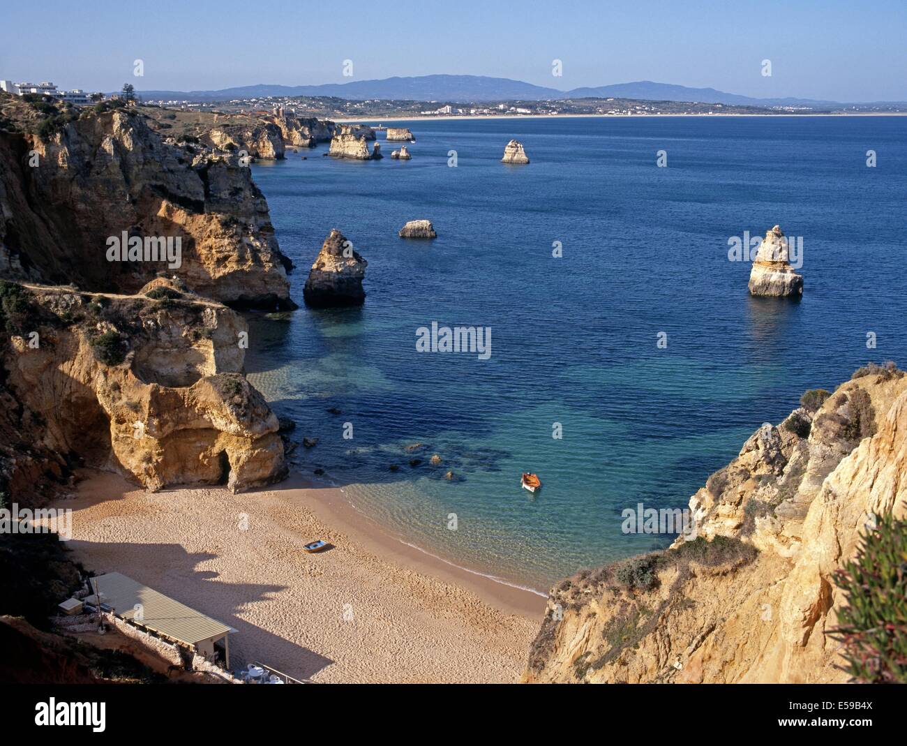 Large rocks along the shoreline, Praia da Rocha, Algarve, Portugal ...
