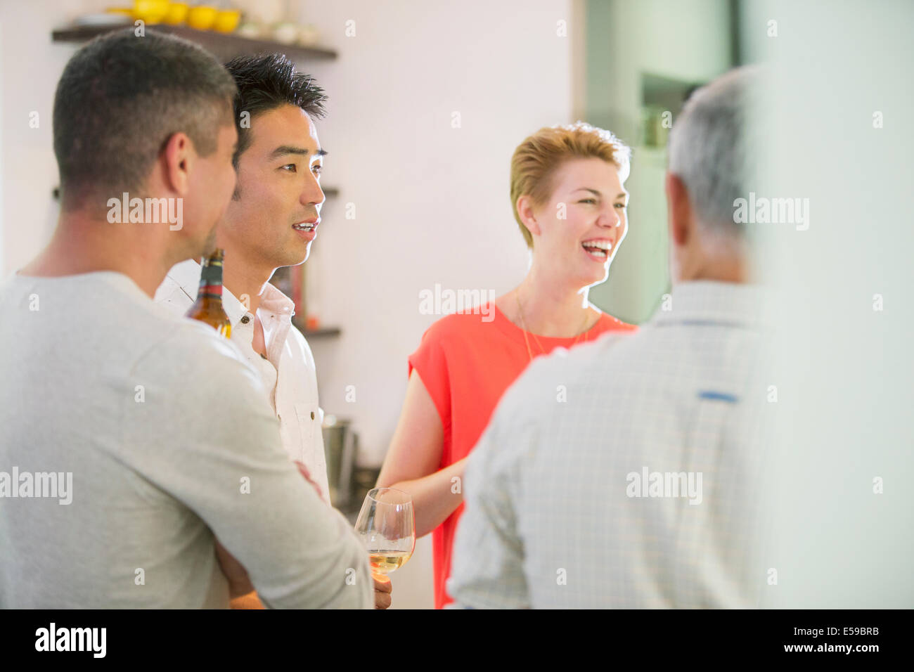 Friends talking at party Stock Photo - Alamy
