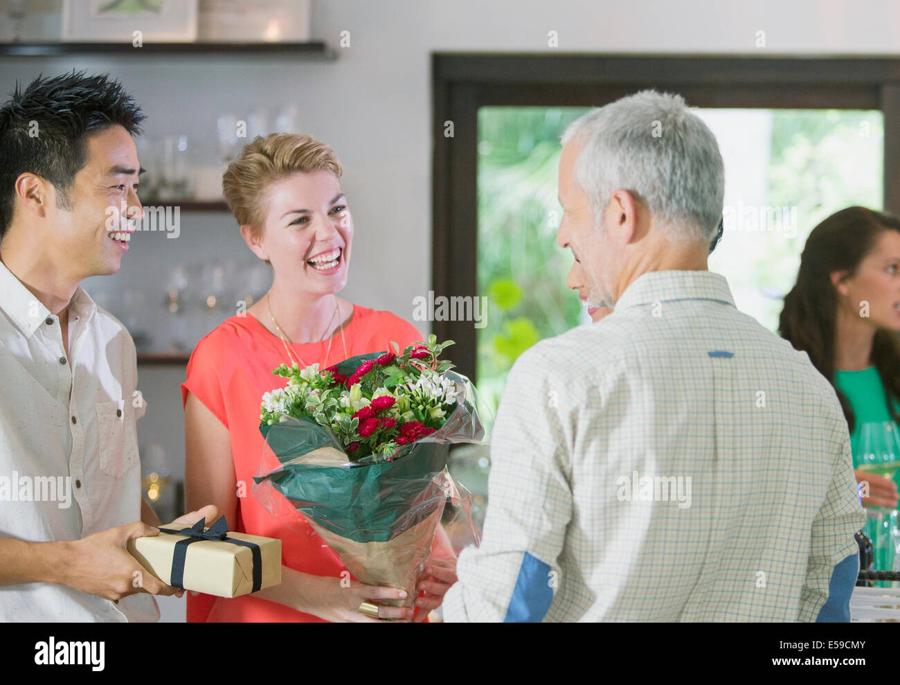 Friends exchanging gifts at party Stock Photo - Alamy