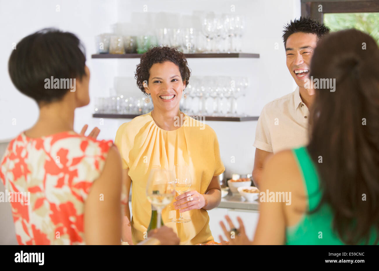 Friends talking at party Stock Photo - Alamy