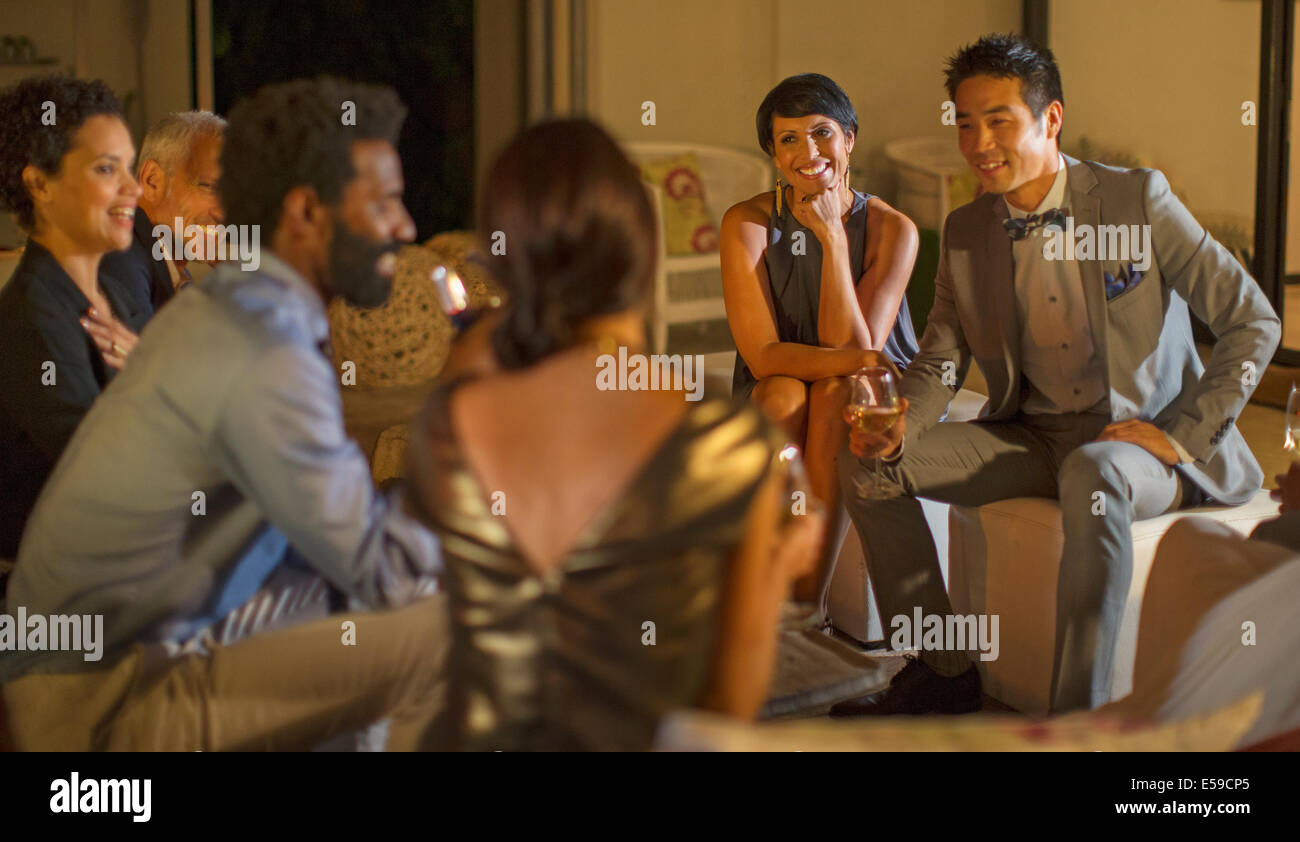 Friends talking at party Stock Photo - Alamy