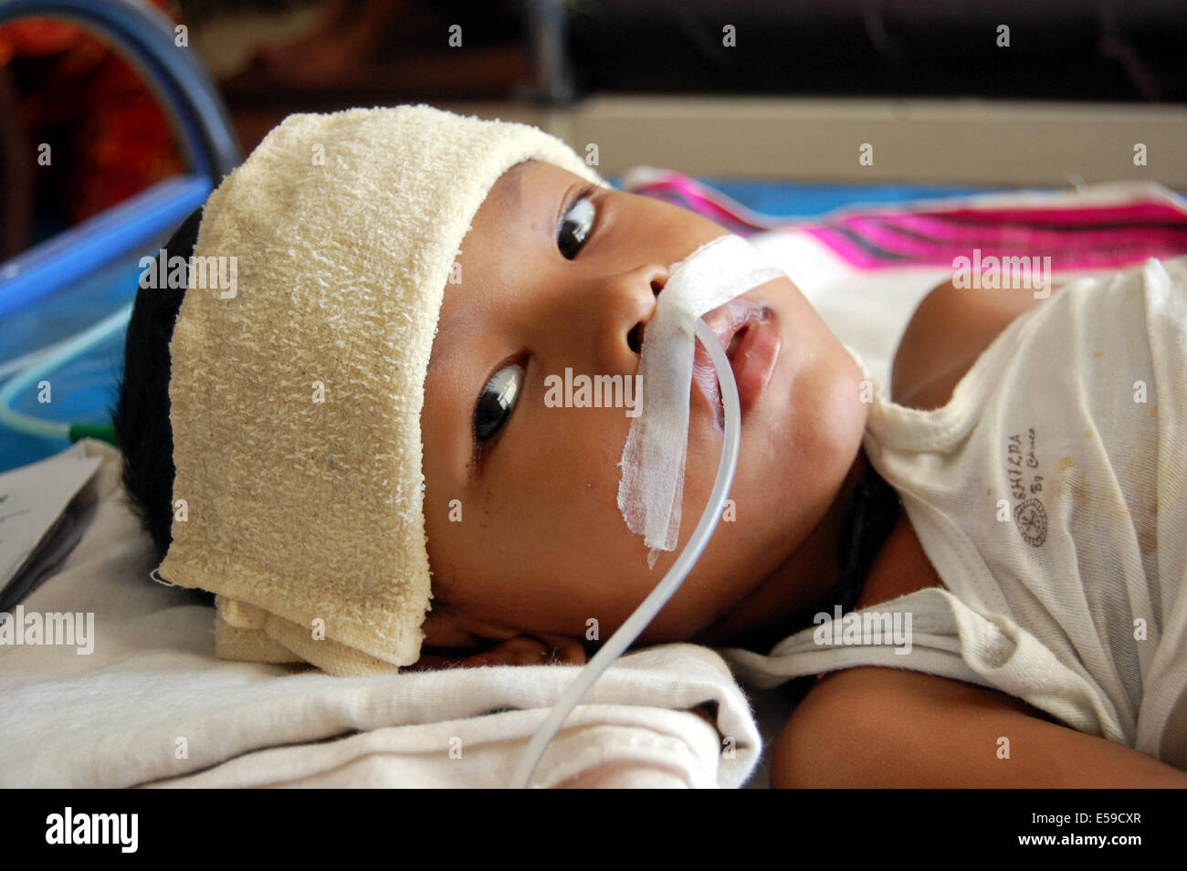Dibrugarh, Assam state of India. 23rd July, 2014. A child receives ...