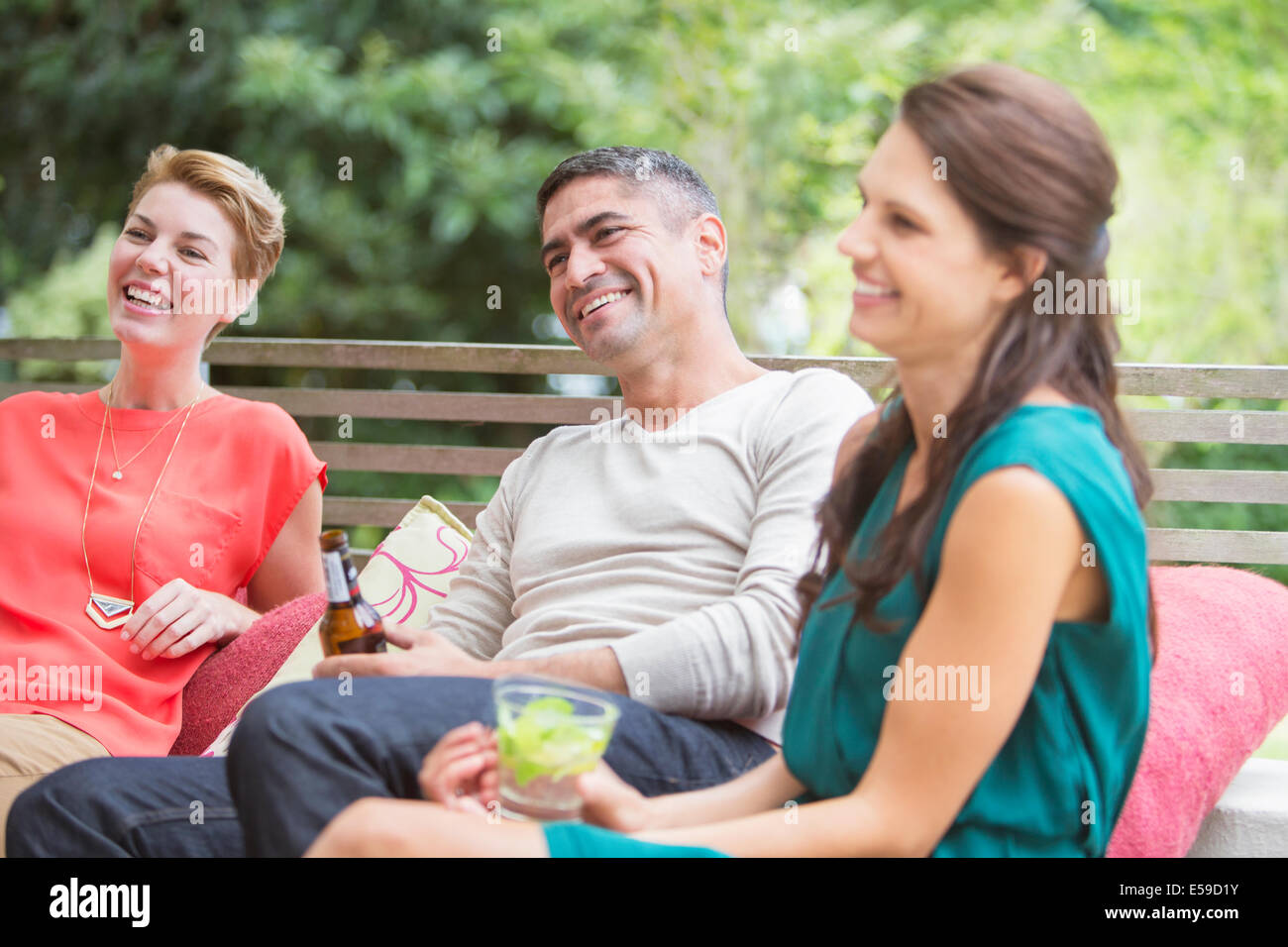 Friends relaxing together outdoors Stock Photo - Alamy