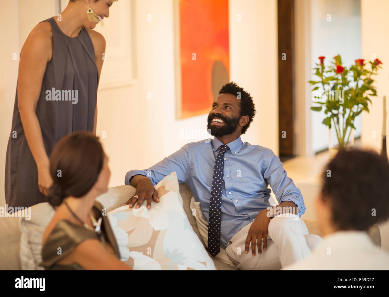 Friends talking at table outdoors Stock Photo - Alamy
