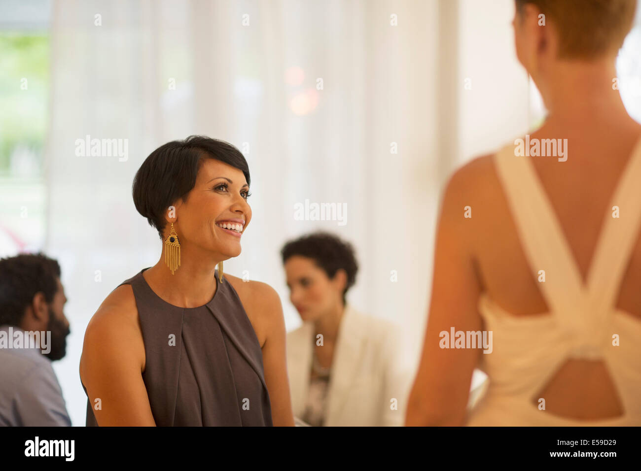 Women talking at party Stock Photo - Alamy